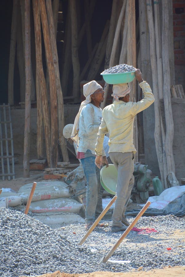 Construction Labour Working at Construction Site Carrying Brick Cement ...