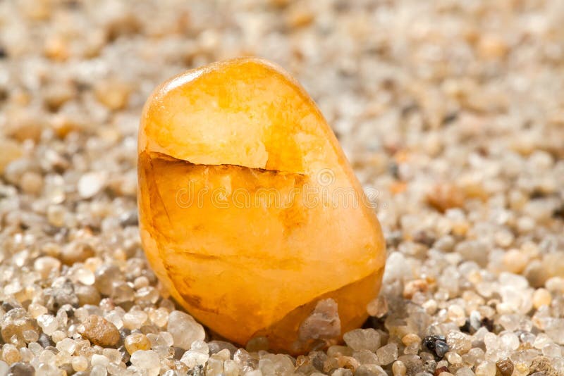 Amber on sand stock image. Image of precious, beach, resin - 30757509