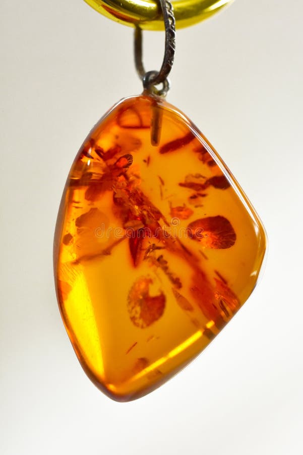 Amber stone pendant stock photo. Image of pendant, close - 164946874