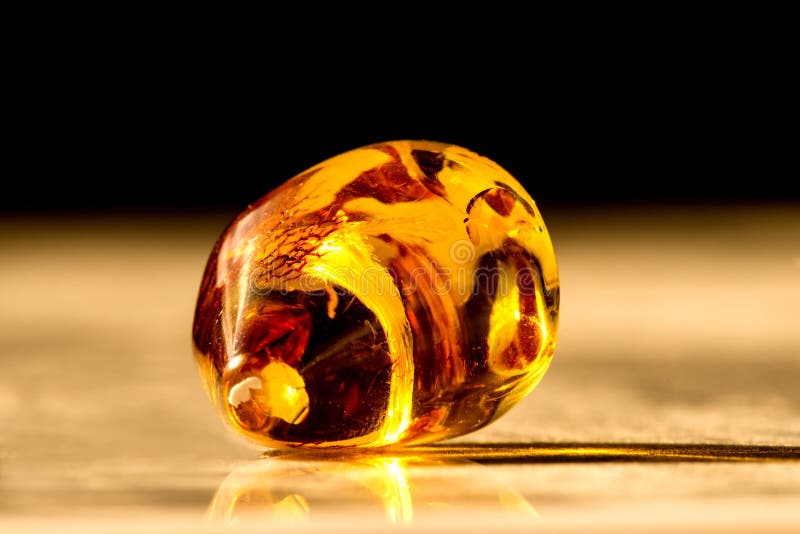 Amber in sun stock photo. Image of jewelery, natural - 105693866