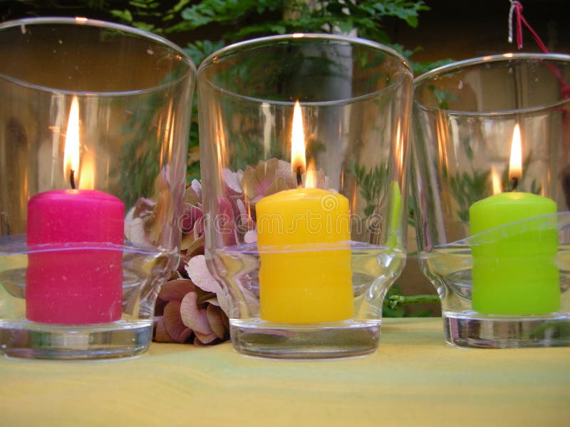 Ambiance candles in garden stock photo. Image of candles - 4420268