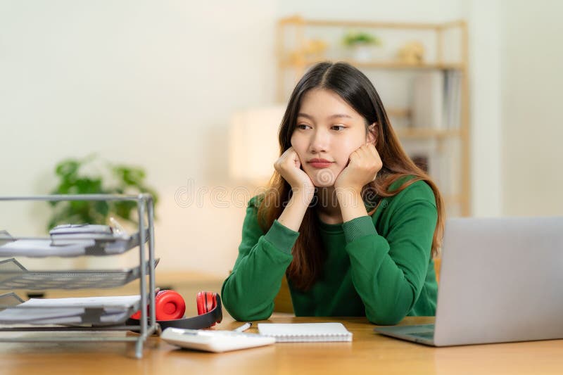 Ambitious Asian Girl Working from Home Looking at Laptop Screen and ...