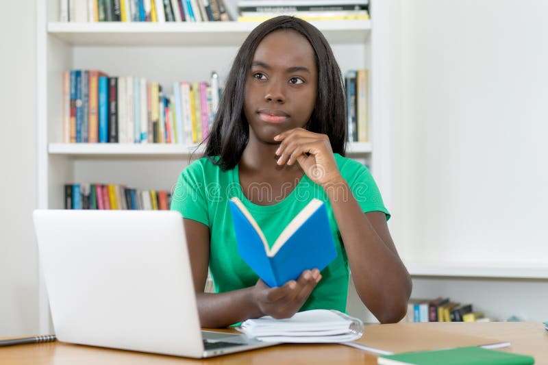 Smart Black Female Student Learning with Books and Computer Stock Image ...