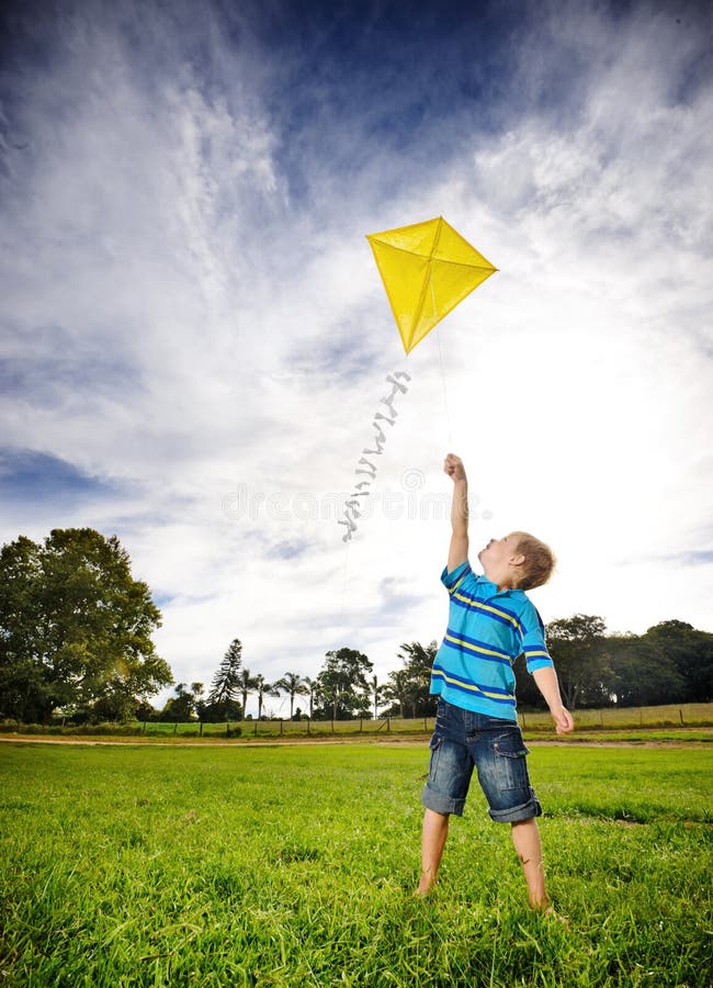 Ambitious boy flying kite stock image. Image of blond - 20378963