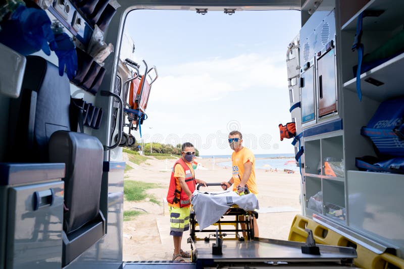 Ambulance and a Team of First Aid Workers Stock Photo - Image of ...