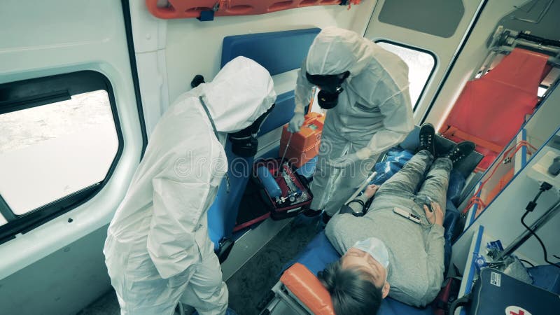 Ambulance Workers Give a Patient Tubes for Breathing during ...