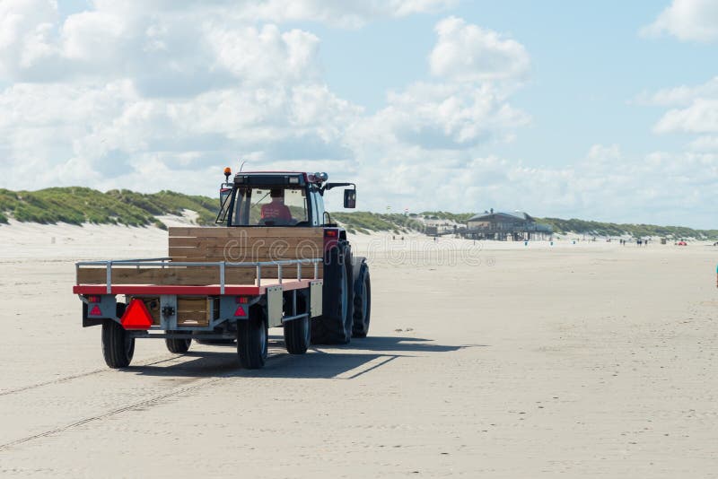 Tractor Drives on the Beach with a Trailer Editorial Image - Image of ...