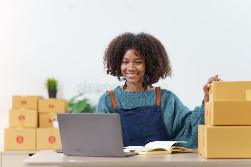 American African Entrepreneur Smile and Checking Online Order ... American African Entrepreneur Smile and Checking Online Order ...