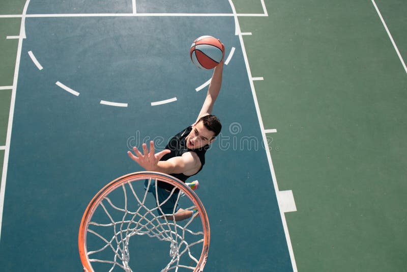American Basketball Player Scoring a Slam Dunk. Stock Photo - Image of ...