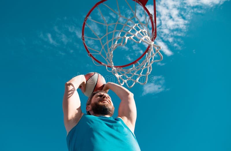 American Basketball Player Scoring a Slam Dunk. Stock Image - Image of ...