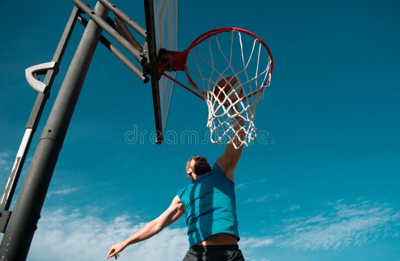 American Basketball Player Scoring a Slam Dunk. Stock Photo - Image of ...