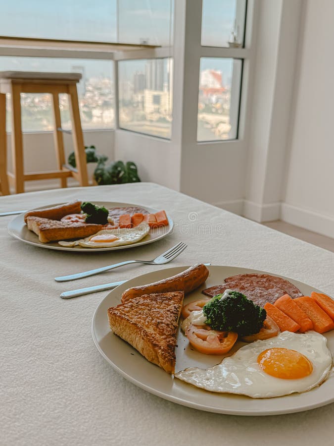 American Breakfast Sets of Fried Eggs, Toasts, Carrots and Hams on ...