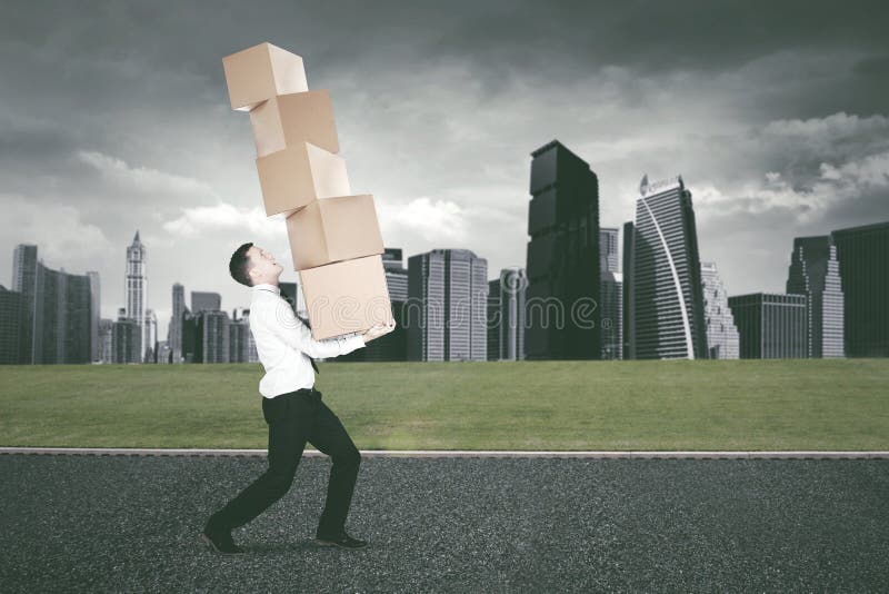 American Businessman Lifting Boxes in the Road Stock Image - Image of ...