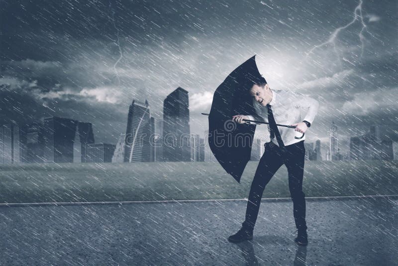 American Businessman Protecting Himself from Storm Stock Image - Image ...