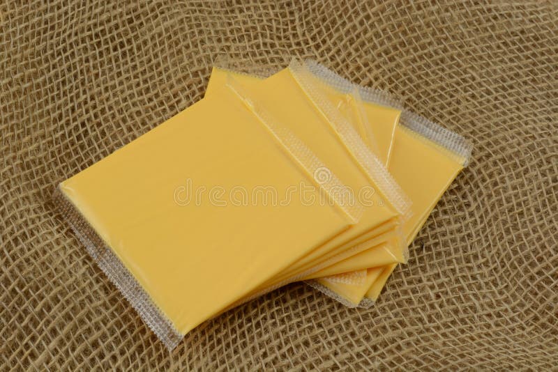 American Cheese Slices in Plastic Stock Photo - Image of wrapped ...