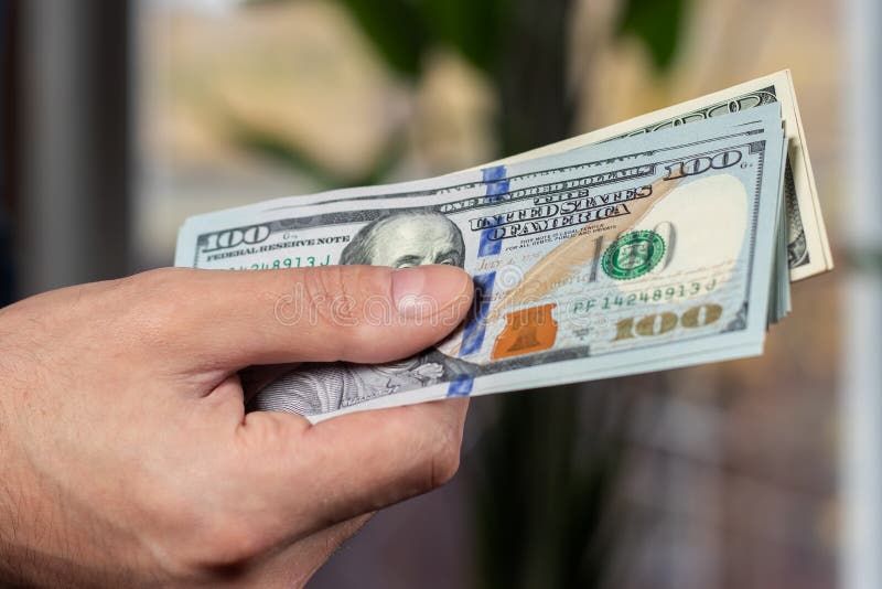 American 100 Dollars Bank Note in Hand Close Up Stock Photo - Image of ...