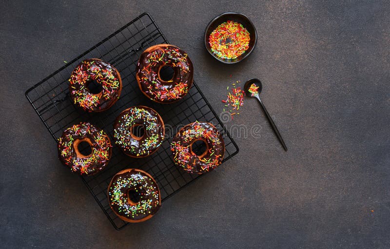 American Donut with Chocolate and Candy on a Concrete Background Stock ...
