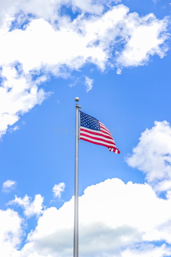 American Flag Against a Beautiful Blue Sky Stock Image - Image of ...