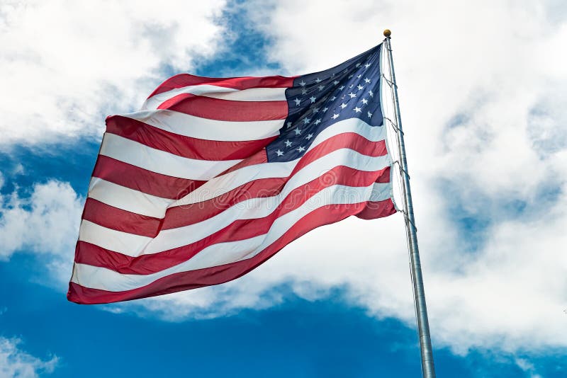 American Flag Against a Cloudy Sky. Low Angle View of Stars and Stripes ...