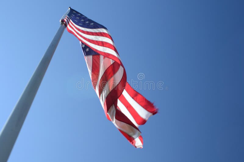 American Flag Blowing in Wind Stock Photo - Image of wind, blowing ...