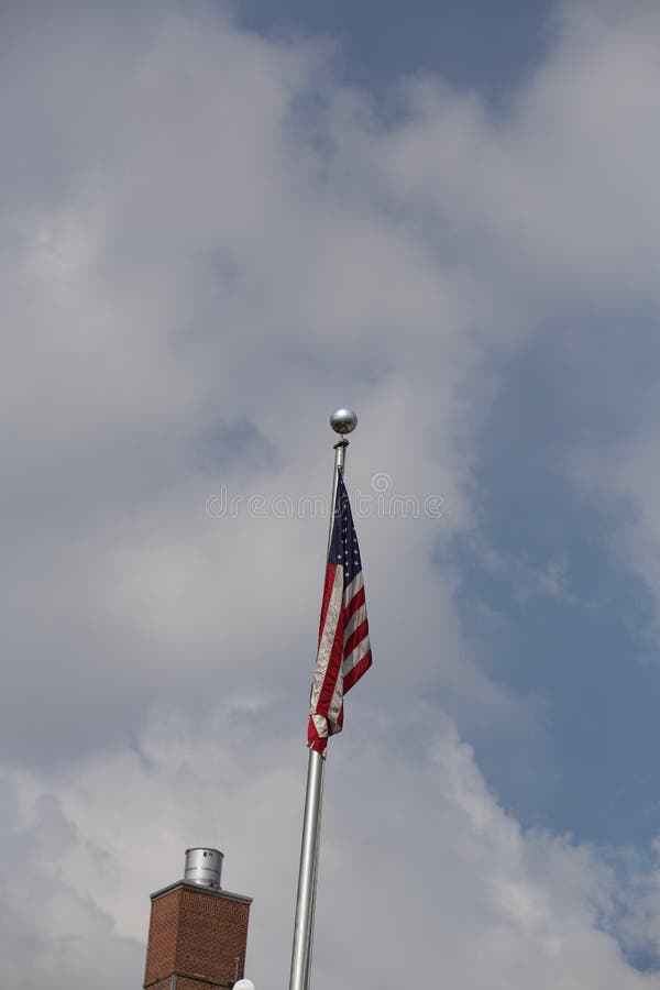 American Flag with Blue Sky on the Back Editorial Photography - Image ...