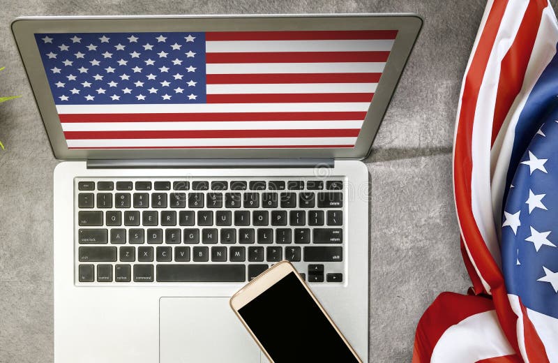 American Flag on the Desk and Laptop Screen Stock Image - Image of blue ...
