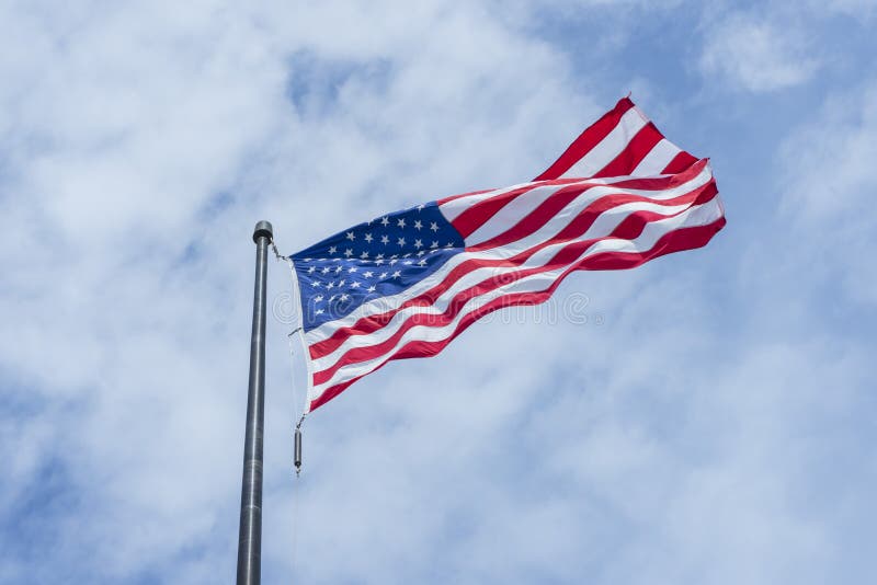 An American Flag Flaping Boldly in the Wind. Stock Photo - Image of ...