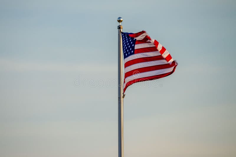 American Flag Flapping in the Breeze at Dawn Stock Image - Image of ...