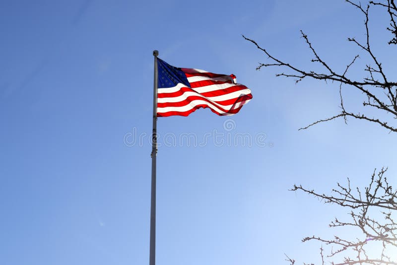 American Flag Flying and Billowing in the Wind Stock Photo - Image of ...