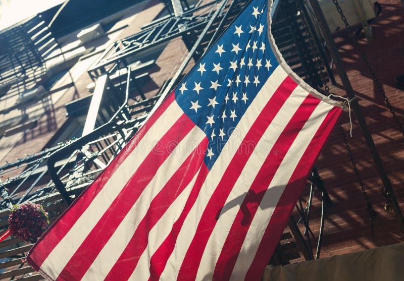 American Flag Flying in the Wind Under the Sun Stock Image - Image of ...