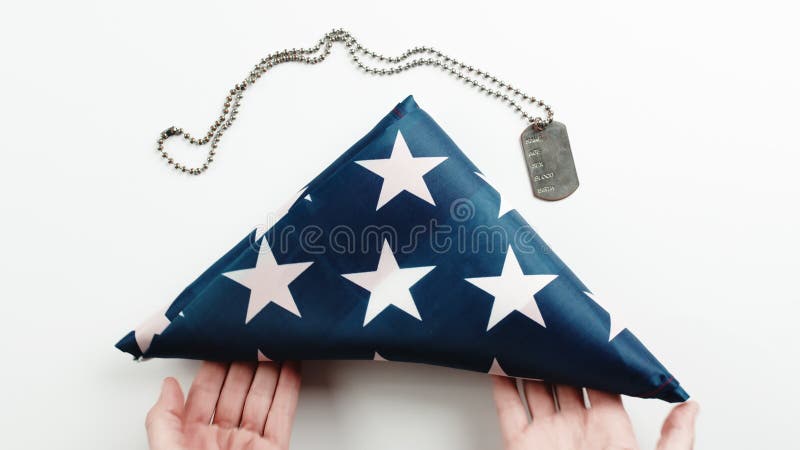 American Flag Folded in a Triangle with Memorial Day Sign Stock Footage ...