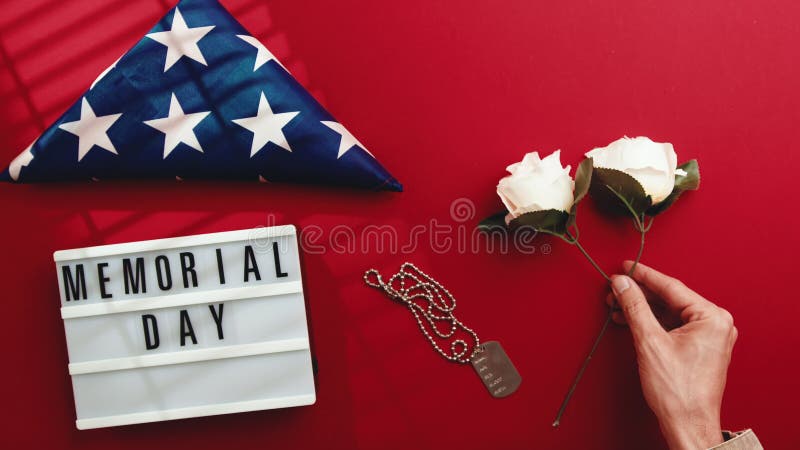 American Flag Folded in a Triangle with Memorial Day Sign Stock Footage ...