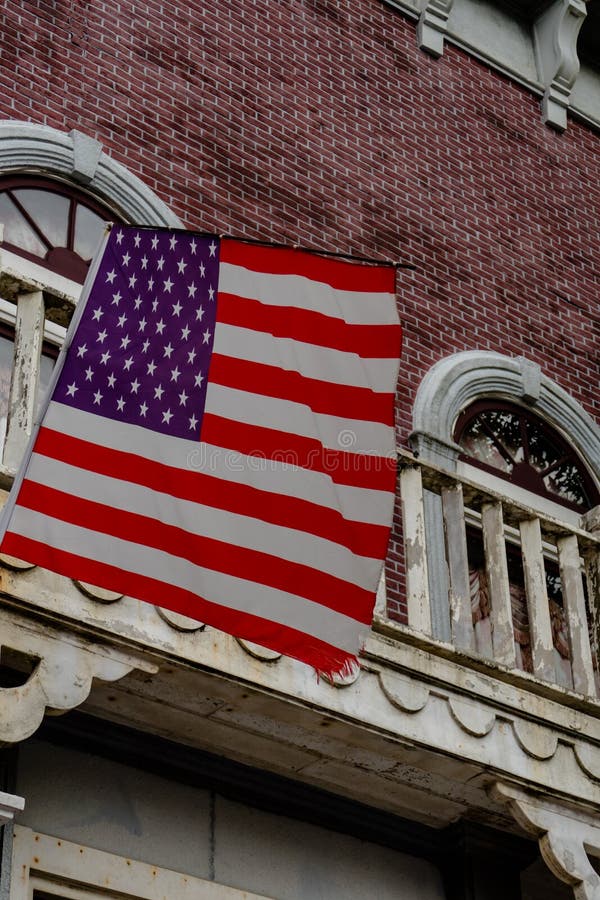 American Flag in Front of Old Style Building Stock Photo - Image of ...