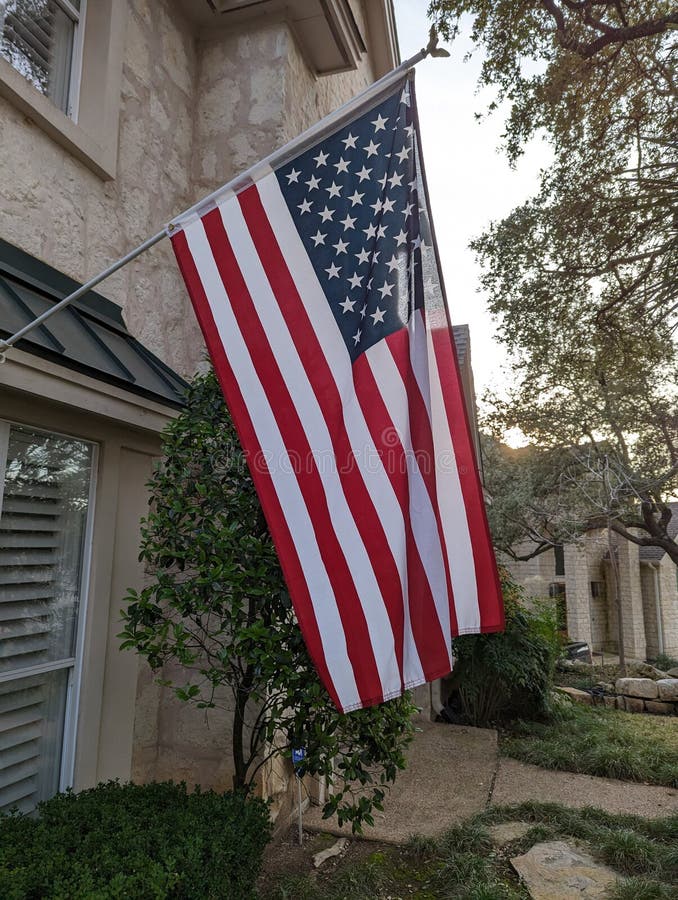 American Flag on a Pole in Front House Stock Image - Image of front ...