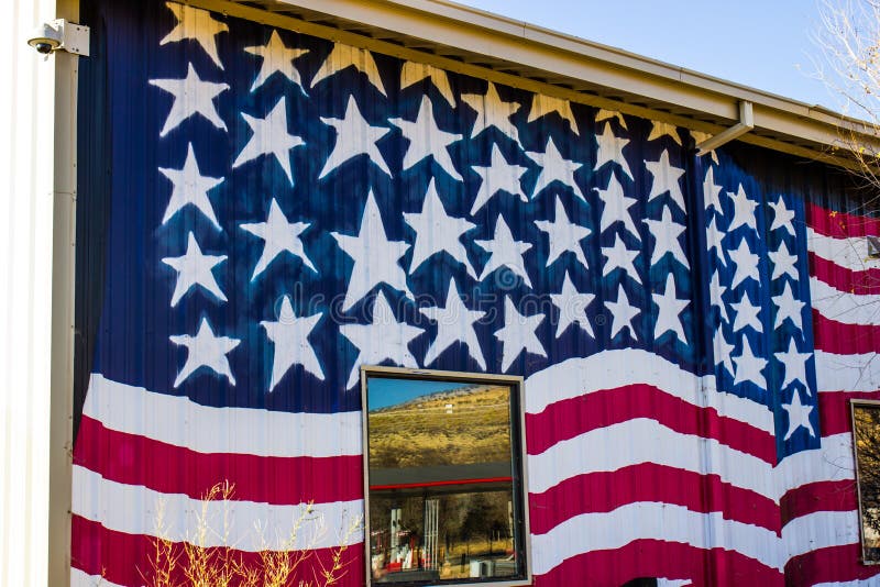 American Flag on Side of Building Stock Photo - Image of flag, reflects ...