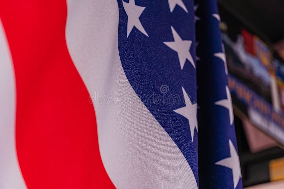 American Flag on a Vertical Surface or Post, Partially Obscured by a ...