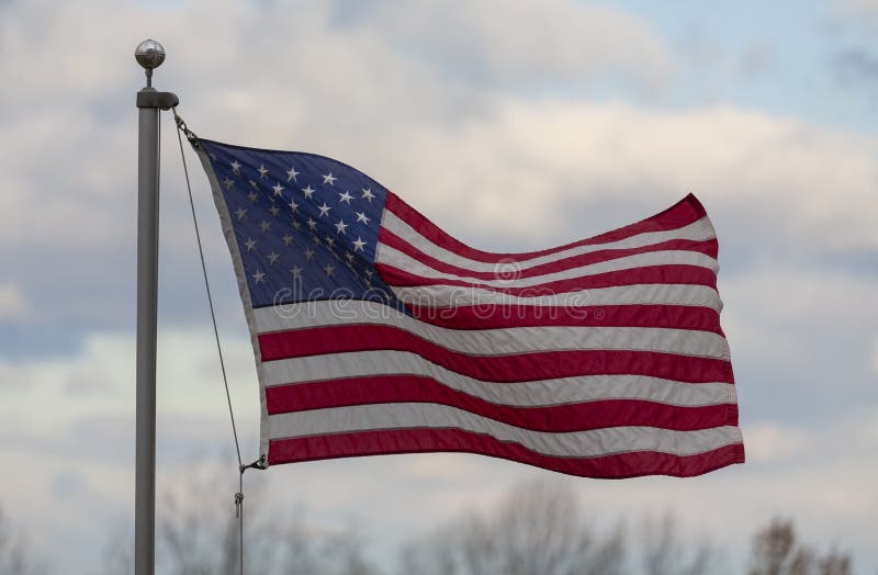 American Flag Waving in the Breeze Stock Image - Image of stars, rope ...