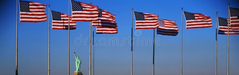 American Flags Flying with Statue of Liberty Stock Photo - Image of ...