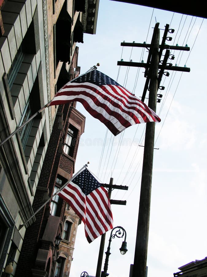 American Flags Hanging from a Building Stock Photo - Image of breeze ...
