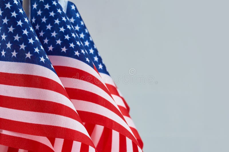 American Flags. Three American Flags with Stars and Stripes on a Light ...