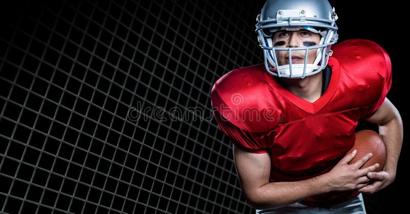 American Football Player Playing Against Net on Black Background Stock ...