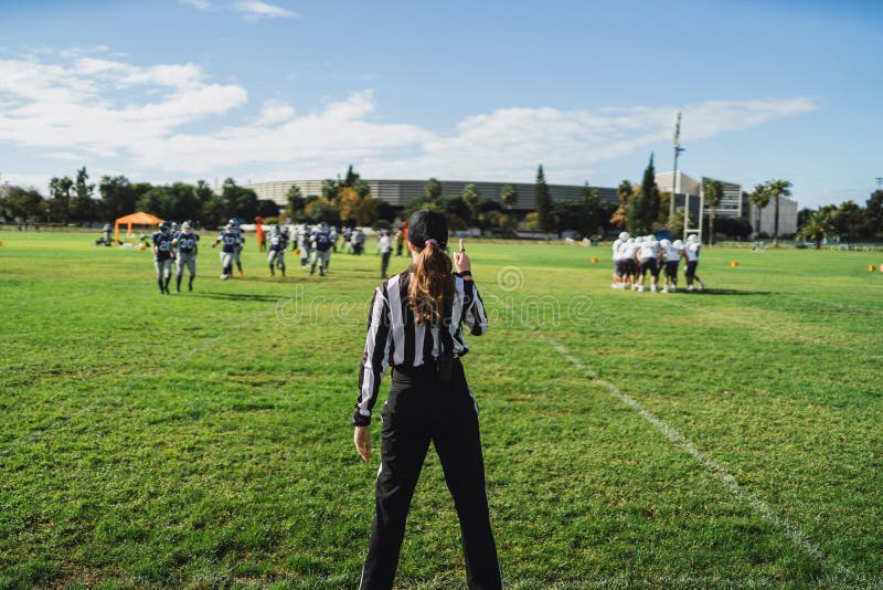 American Football Referee Standing on the Field Watching the Game ...