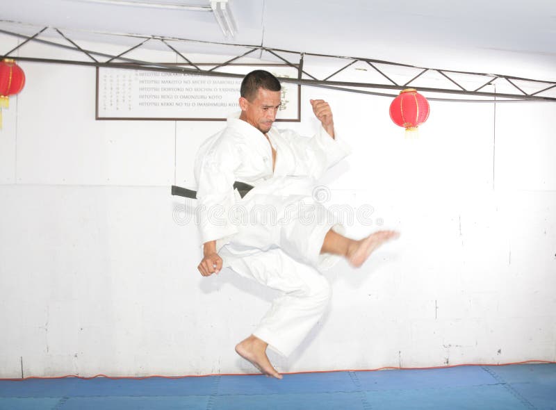American Man in Karate Suit, Suspended in Mid Air Stock Image - Image ...