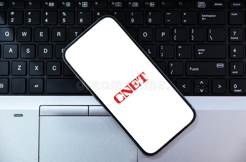 American Media Website CNET on the Mobile Screen with Laptop in the ...