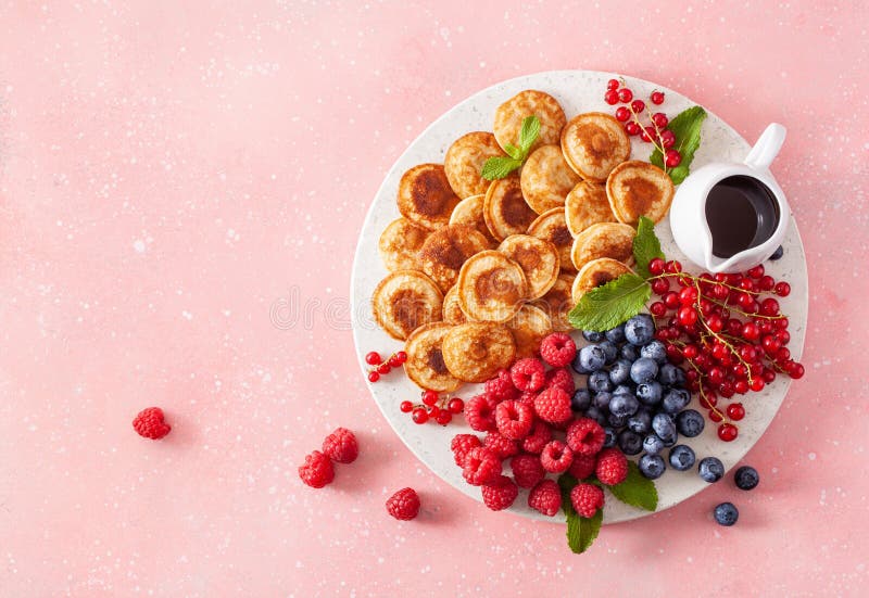 American Mini Pancake Board with Berries and Maple Syrup Stock Photo ...