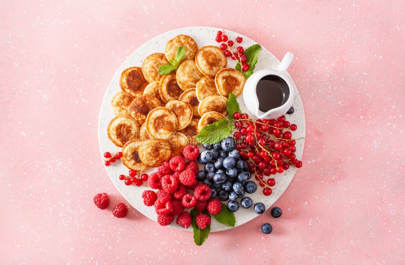 American Mini Pancake Board with Berries and Maple Syrup Stock Photo ...