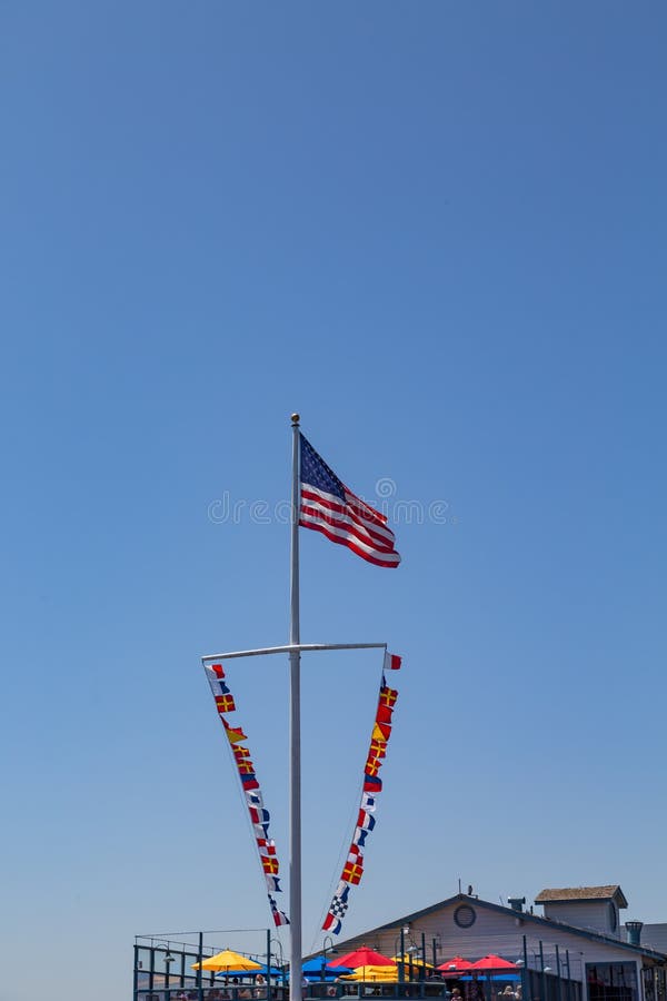 American and Nautical Flags Over Restaurant Stock Image - Image of ...