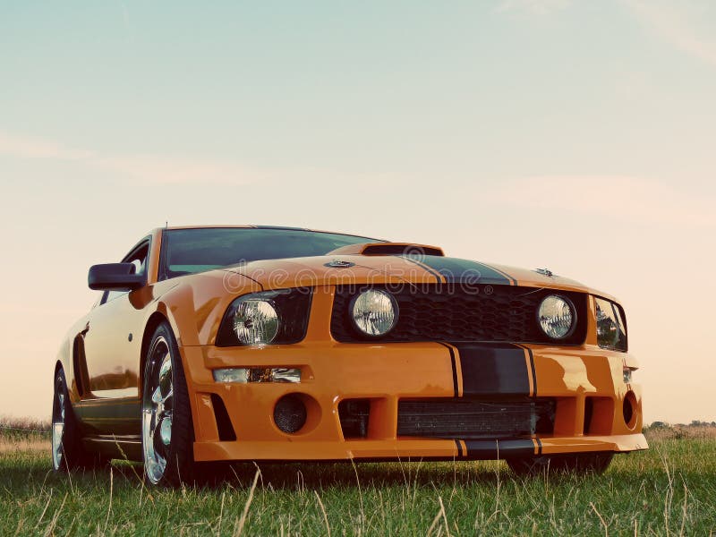 American Orange Muscle Car stock photo. Image of rims - 23721816