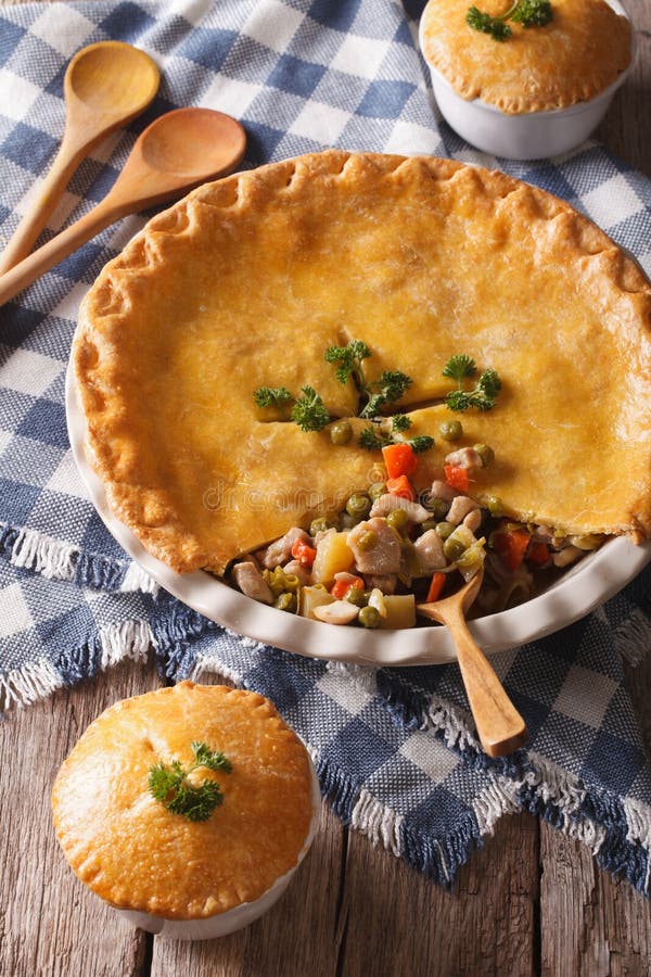 American Pastries: Big Chicken Pot Pie on the Table. Vertical Stock ...