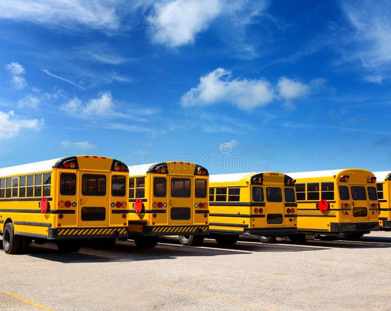 American School Bus Row Under Blue Sky Stock Image - Image of ...